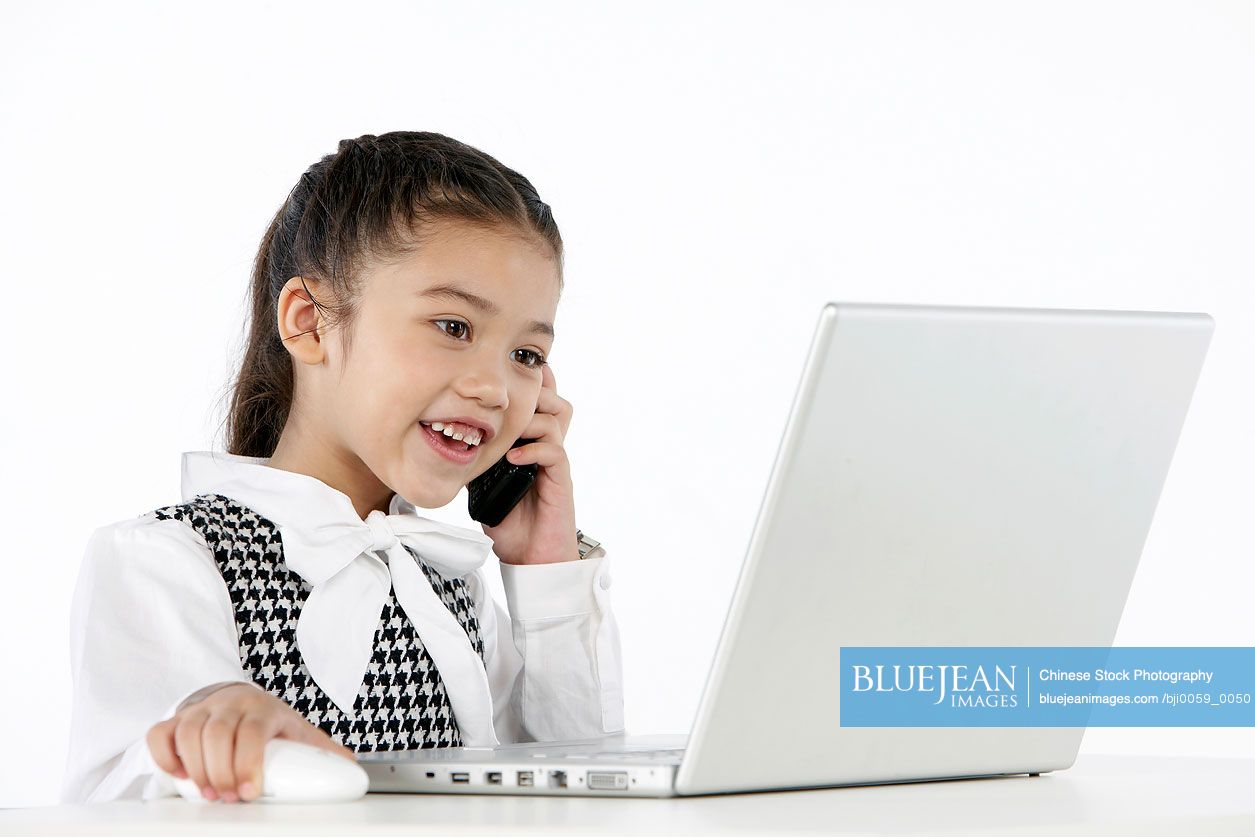 Girl Talking On The Phone And Using Laptop-High-res stock photo for ...