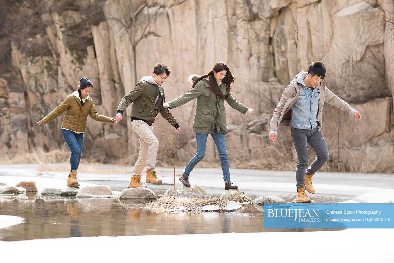 happy-young-chinese-friends-enjoying-winter-outing-high-res-stock-photo