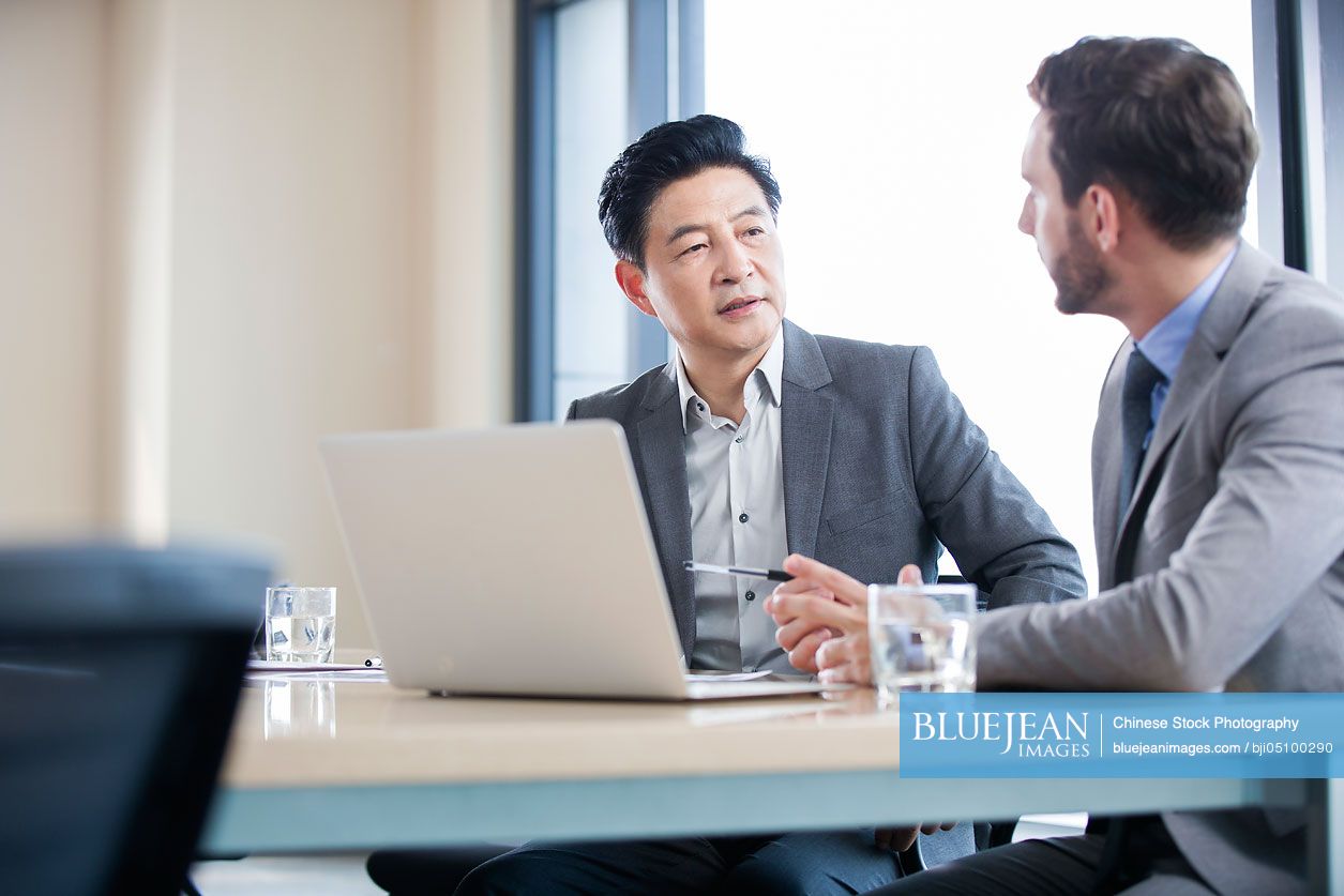 Chinese business people talking in meeting room-High-res stock photo ...