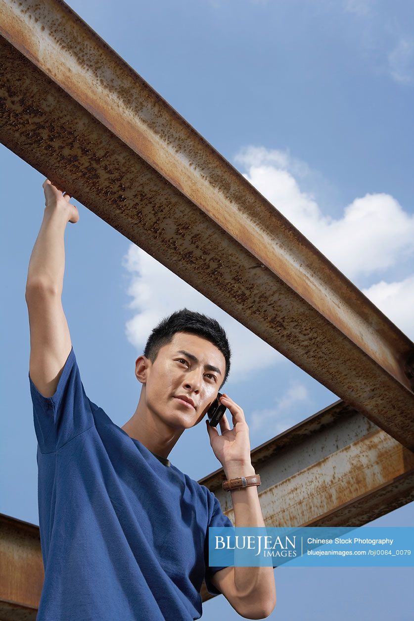 Chinese man talking on cell phone-High-res stock photo for download