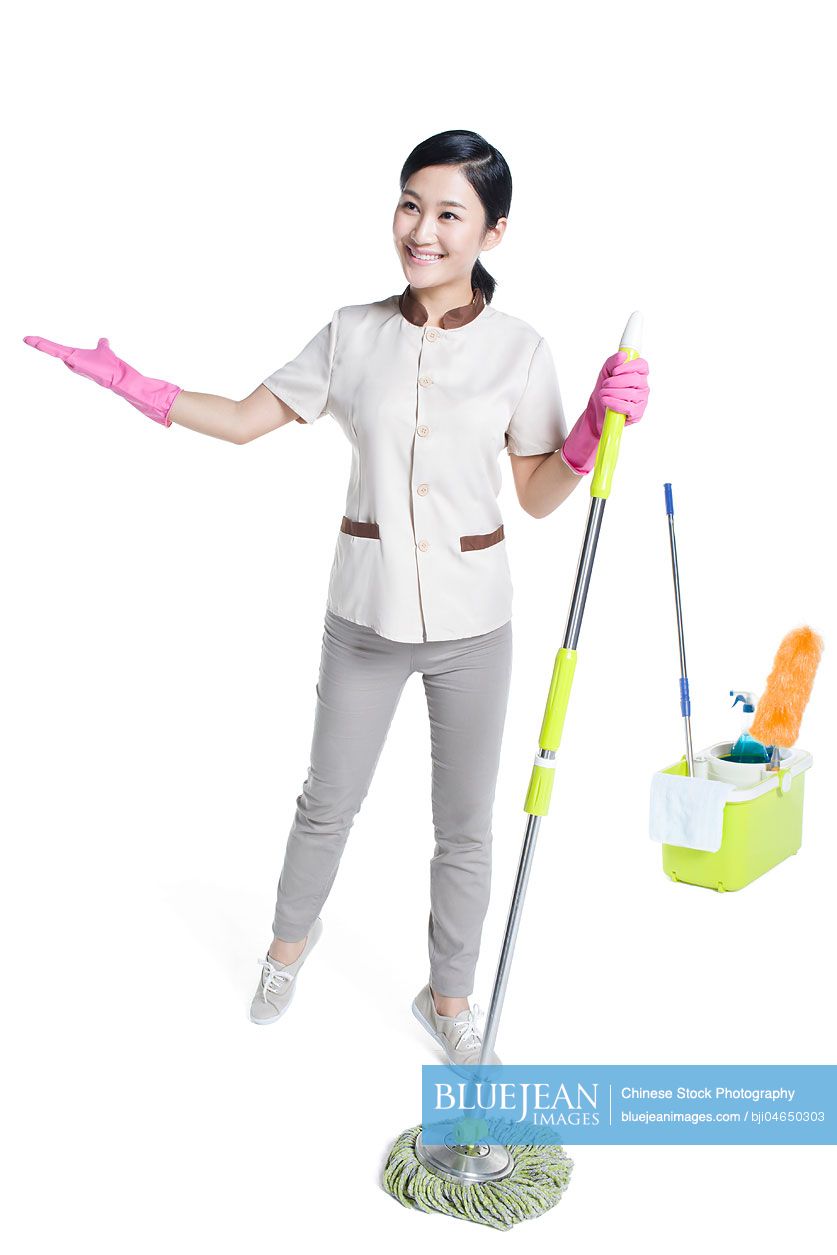 Chinese cleaner holding a mop-High-res stock photo for download