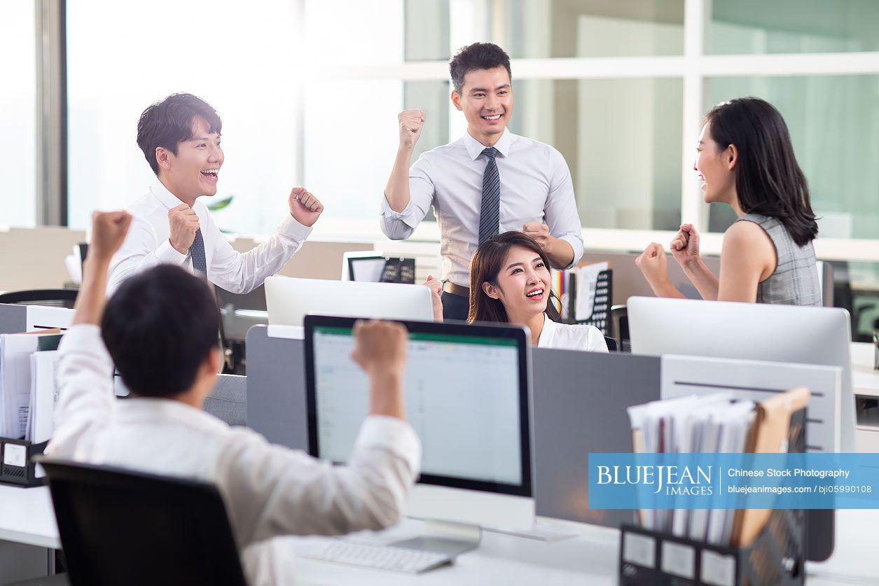 Chinese business people cheering hands in office-High-res stock photo ...