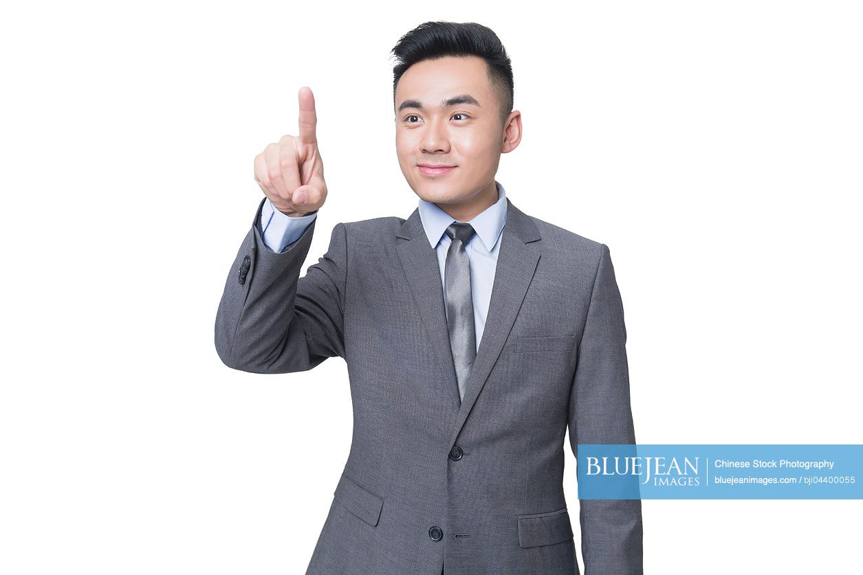 Young Chinese businessman using finger to point-High-res stock photo ...