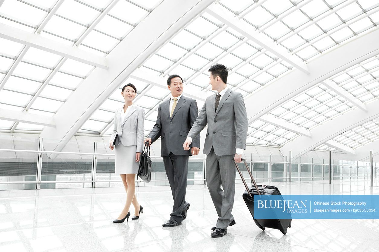 Chinese business partners on the move in airport lobby-High-res stock ...