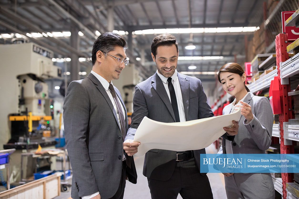 Business people talking in the factory-High-res stock photo for download