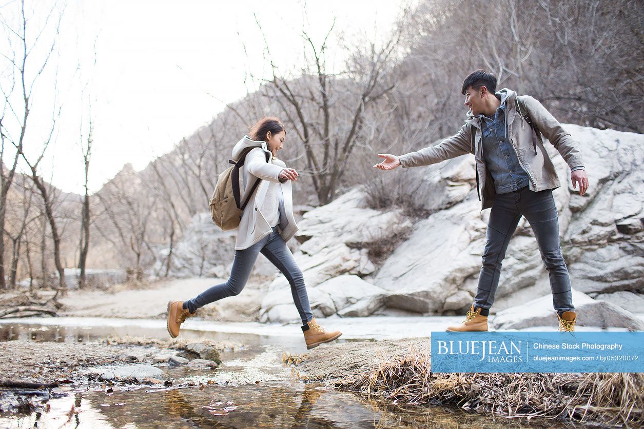 Happy young Chinese couple enjoying winter outing-High-res stock photo for download