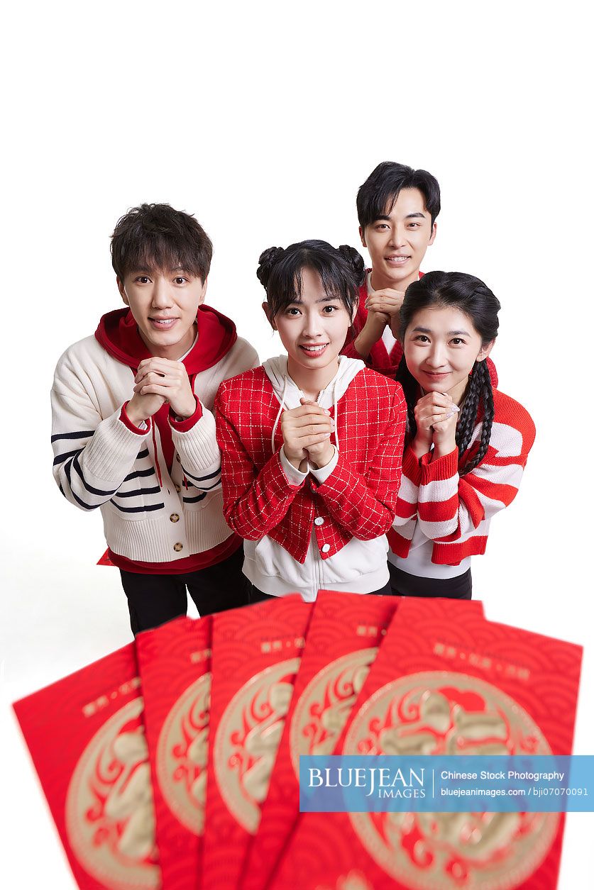 Happy young Chinese friends celebrating Chinese new year-High-res stock ...