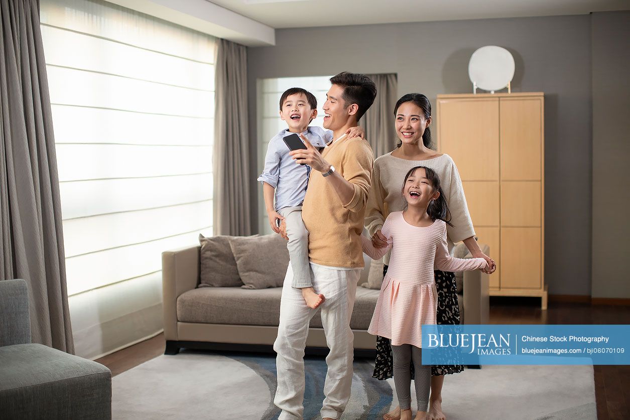 Young Chinese family and smart home-High-res stock photo for download