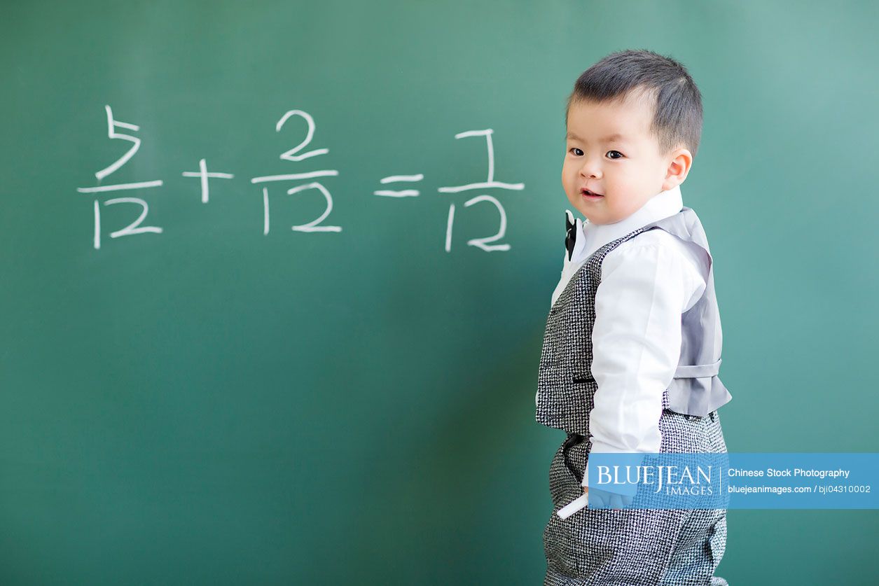 Cute Chinese baby doing mathematics on blackboard-High-res stock photo ...