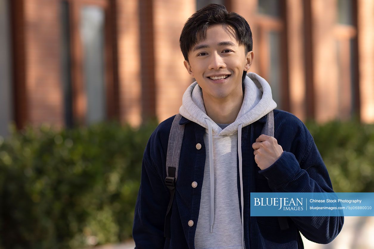 Portrait of cheerful Chinese college student-High-res stock photo for ...