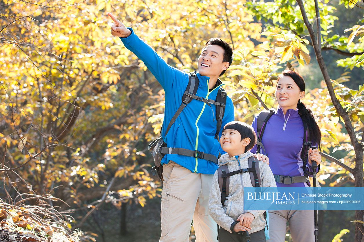 Happy Chinese family with back packs on a hike-High-res stock photo for ...
