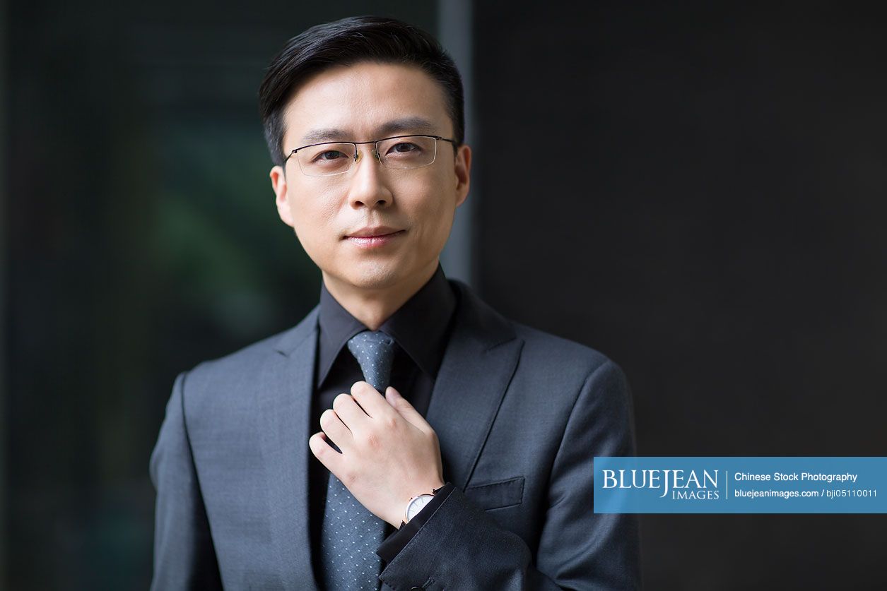 Portrait of mid adult Chinese businessman-High-res stock photo for download