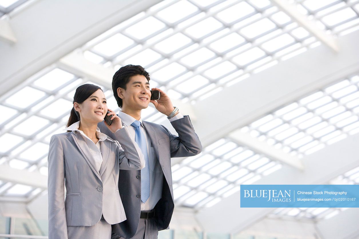 Chinese business partners on the phone-High-res stock photo for download