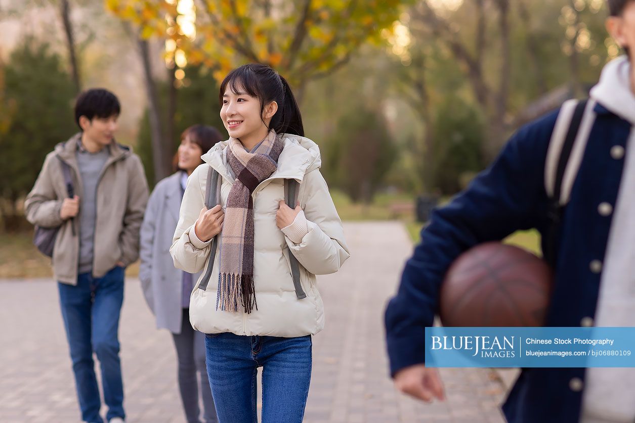 Happy Chinese college students walking on campus-High-res stock photo ...