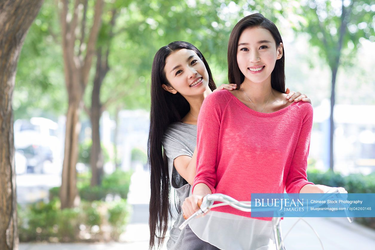 Best Chinese female friends riding bicycle at campus-High-res stock ...