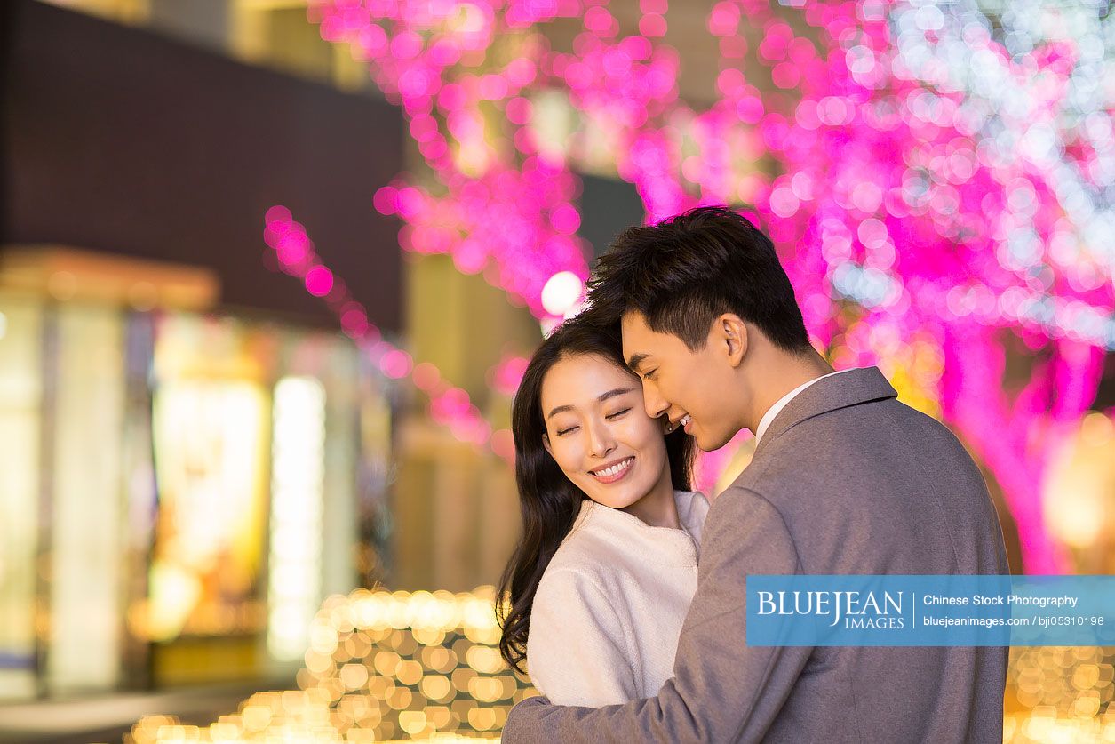 Cheerful young Chinese couple dating-High-res stock photo for download