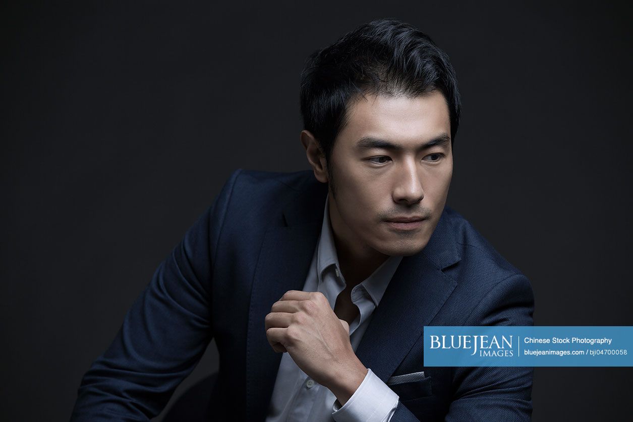 Chinese businessman thinking-High-res stock photo for download