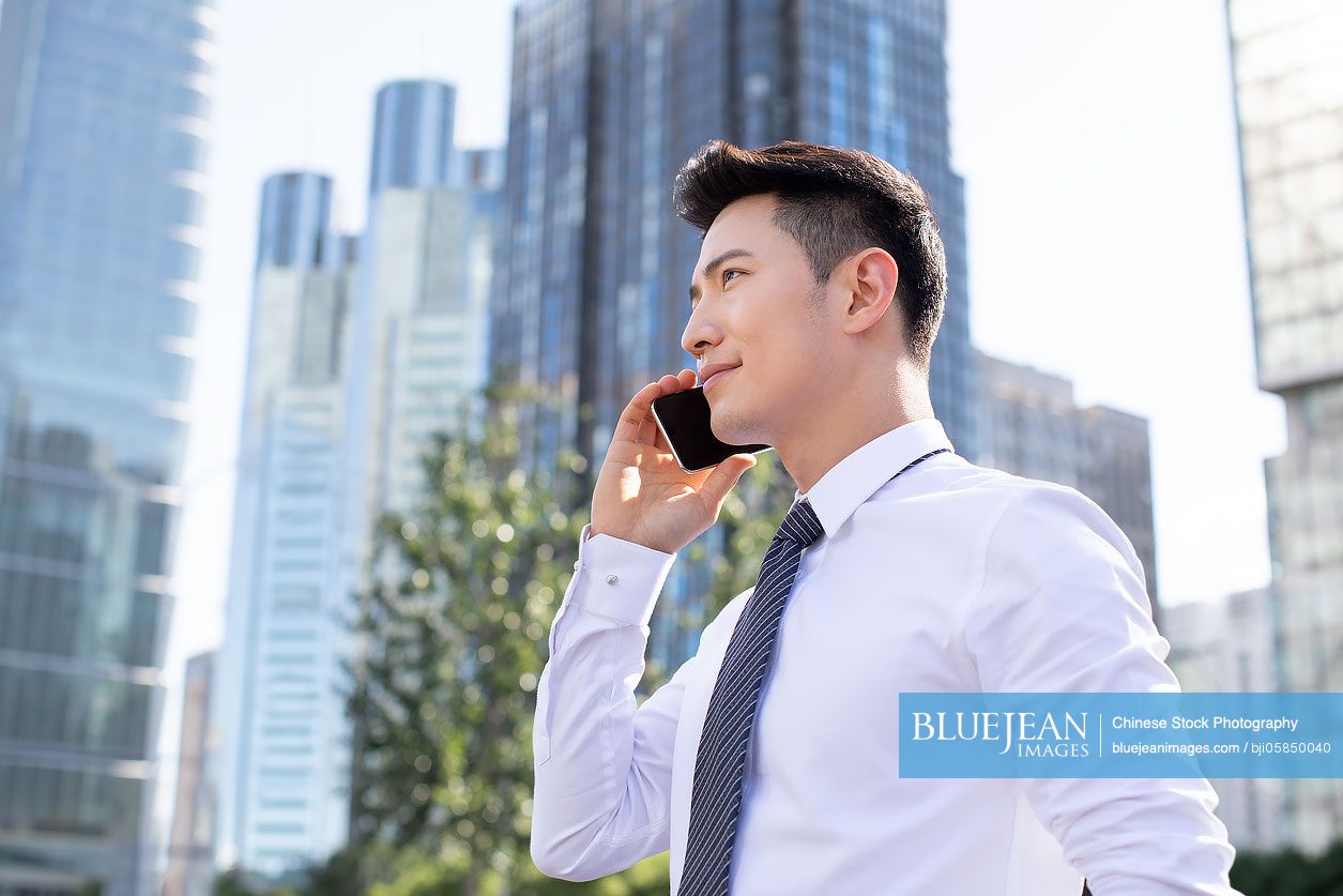 Confident young Chinese businessman on the phone-High-res stock photo ...