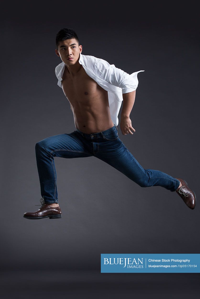 Young Chinese muscular man jumping-High-res stock photo for download