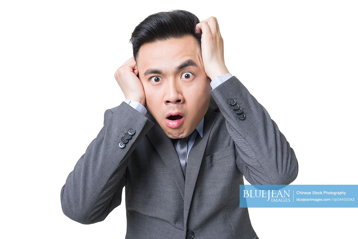 Young Chinese businessman with terrified expression-High-res stock ...