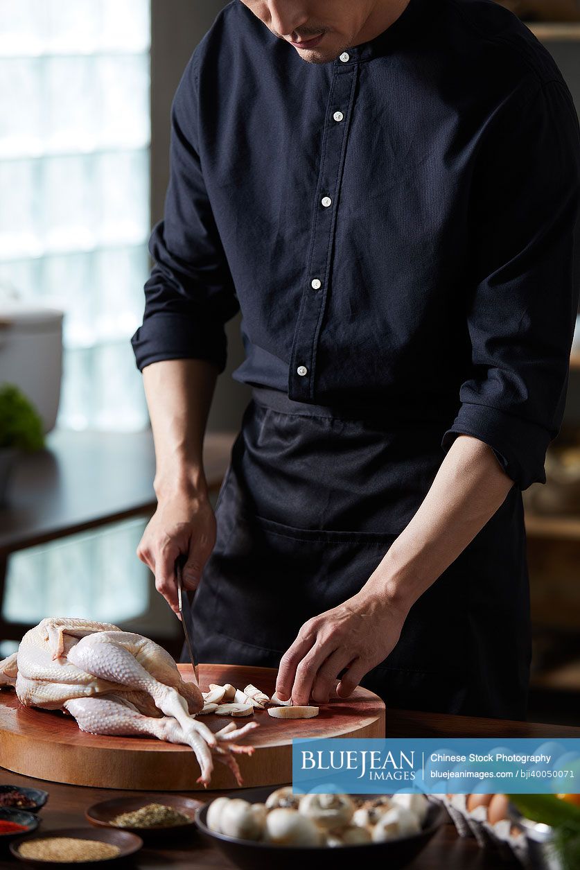 Chinese cook making dishes in the kitchen-High-res stock photo for download
