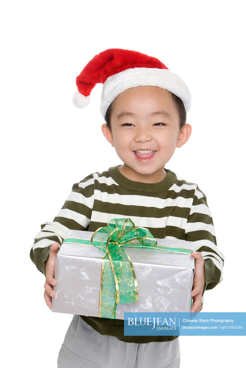 Little Chinese boy holding gift box-High-res stock photo for download