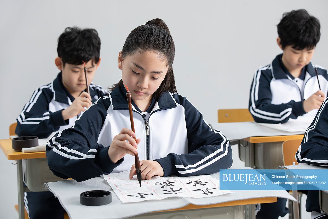 Chinese students practicing calligraphy in classroom-High-res stock ...
