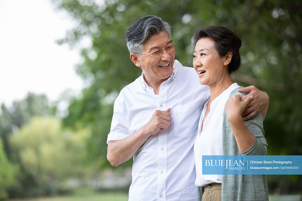 Happy senior Chinese couple relaxing in park-High-res stock photo for download