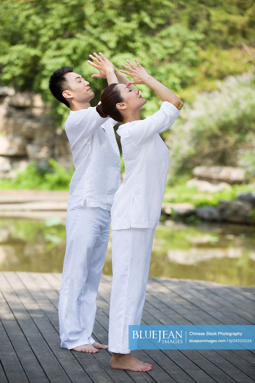 Young Chinese adult practicing yoga-High-res stock photo for download
