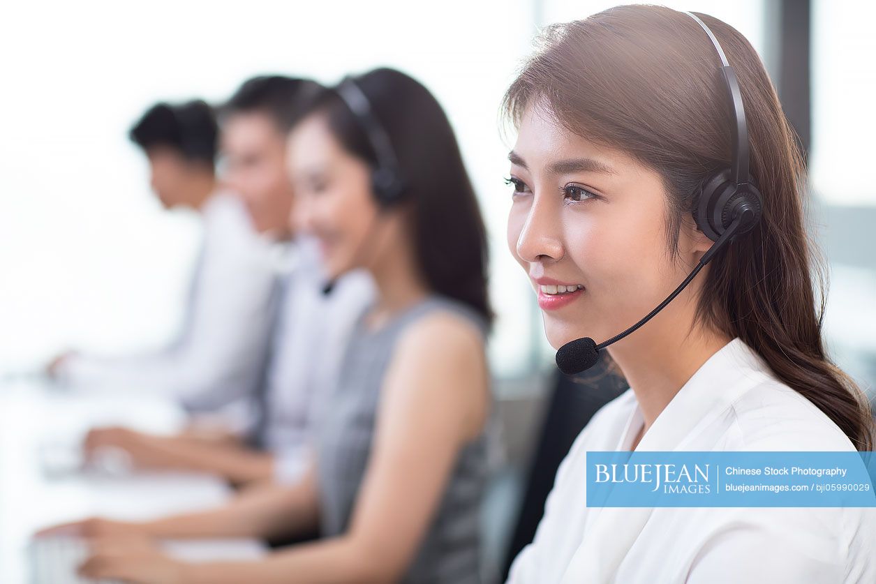 Professional Chinese customer service staff in office-High-res stock ...