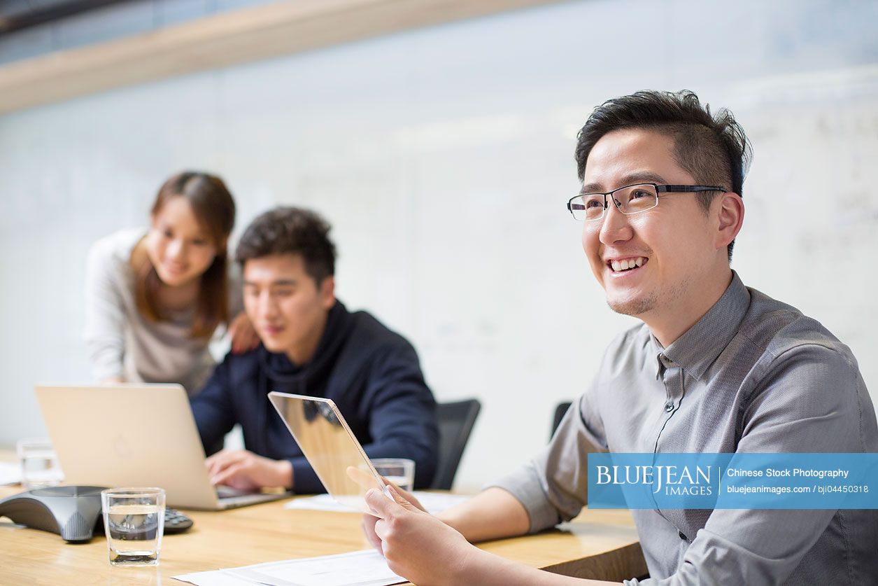 Chinese IT workers developing digital tablet-High-res stock photo for ...