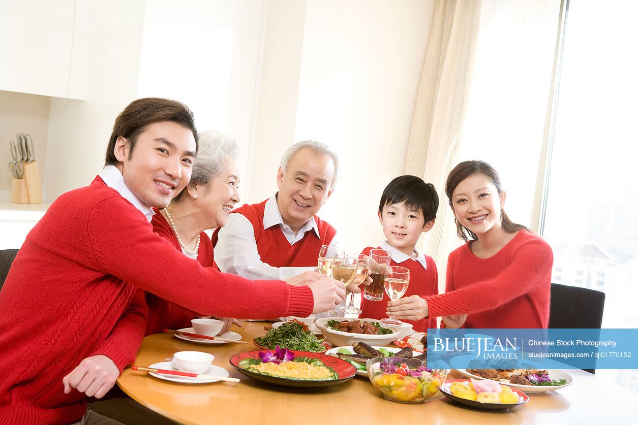 Chinese three generations enjoying a Chinese New Year dinner together ...