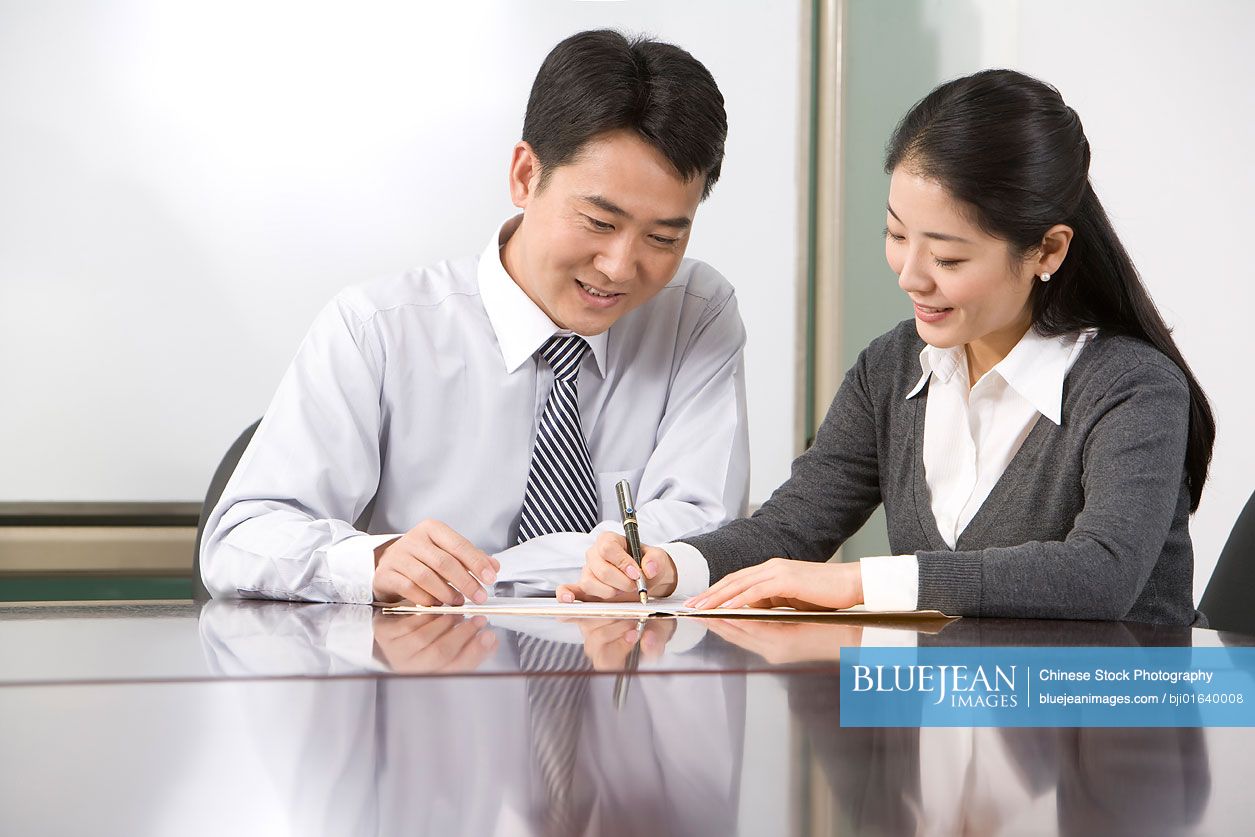 Chinese officemates working together-High-res stock photo for download