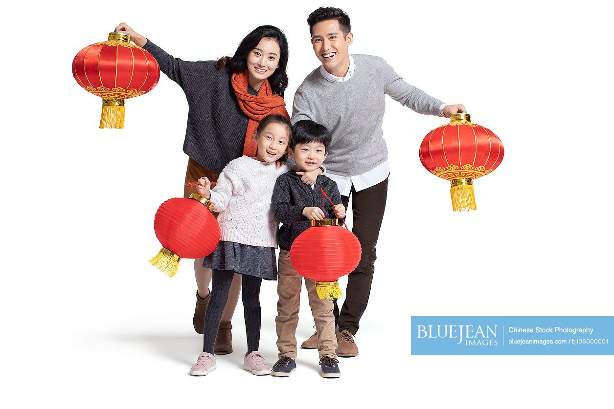 Happy young Chinese family holding lanterns-High-res stock photo for ...