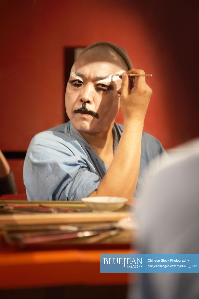 Chinese Performer Applying Face Paint With Brush-High-res stock photo ...