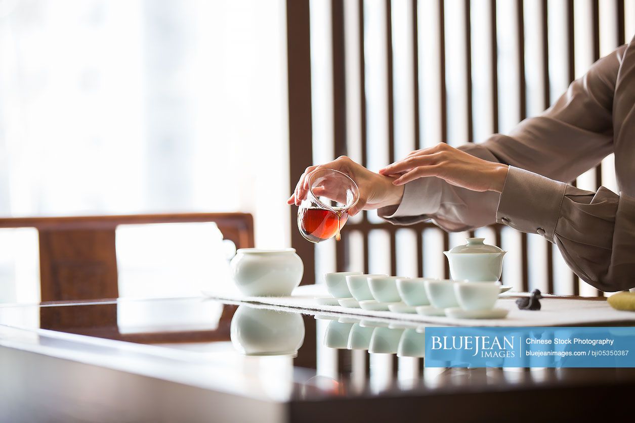 Young Chinese woman performing tea ceremony-High-res stock photo for ...