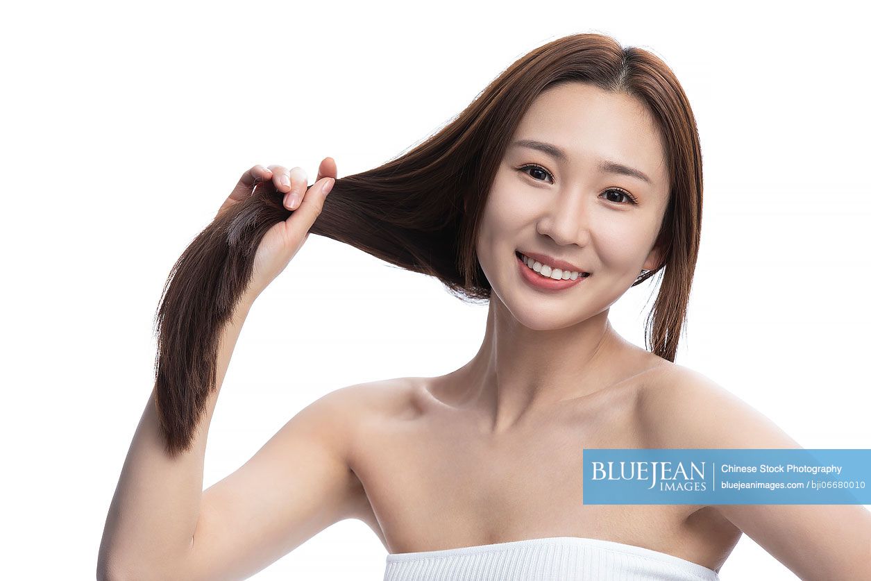 Beautiful young Chinese woman with long hair-High-res stock photo for download