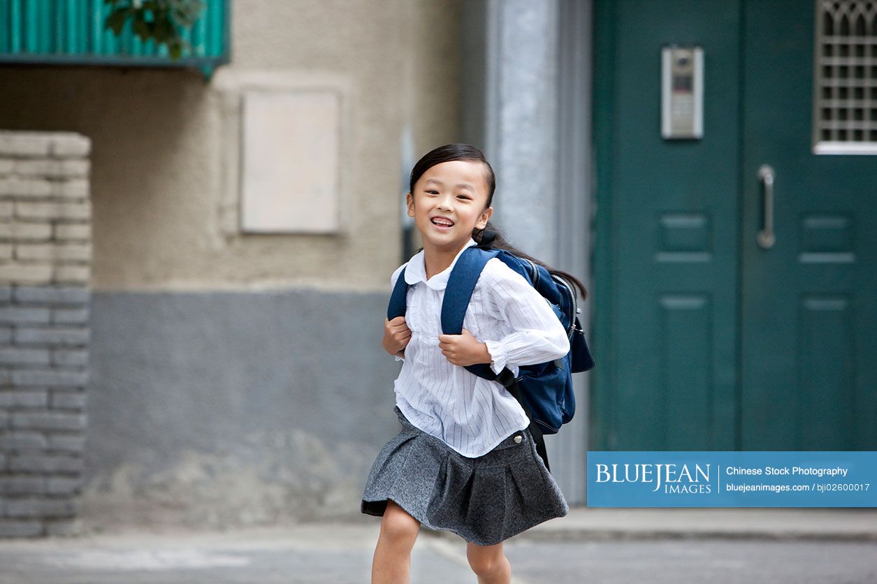 Chinese girl running to school-High-res stock photo for download