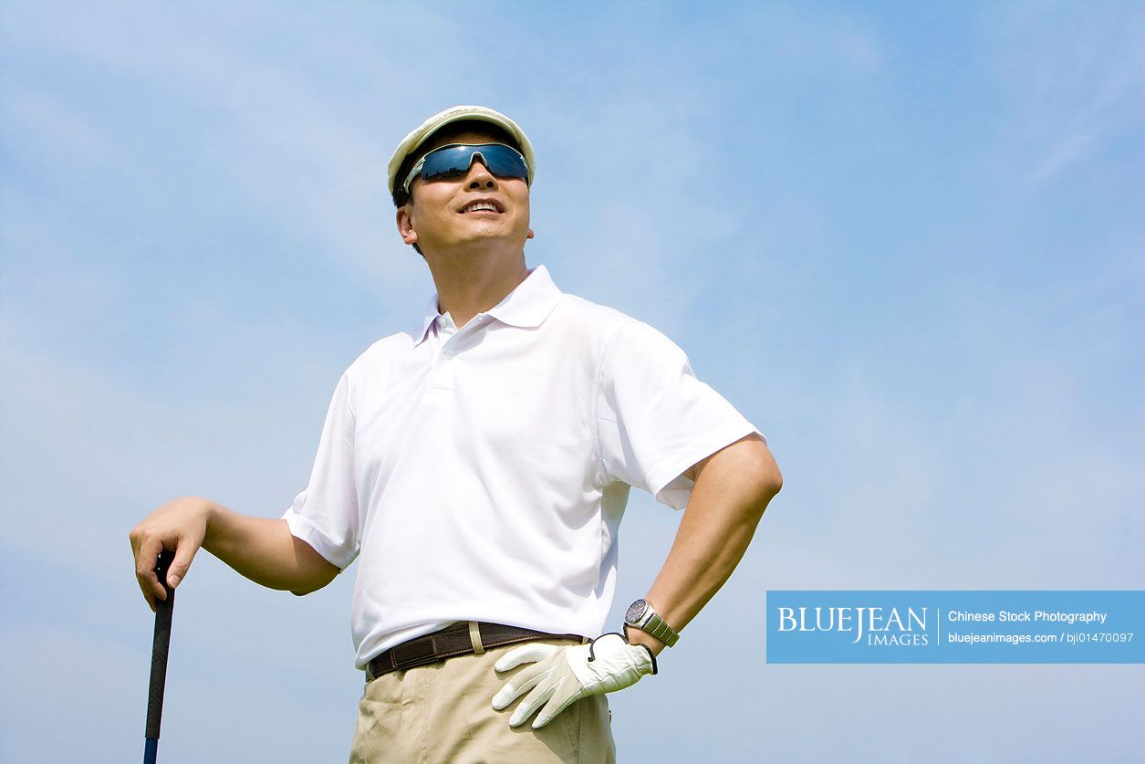 Portrait of a male Chinese golfer-High-res stock photo for download