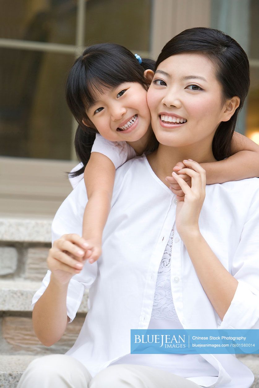 Chinese mother and daughter holding together-High-res stock photo for ...
