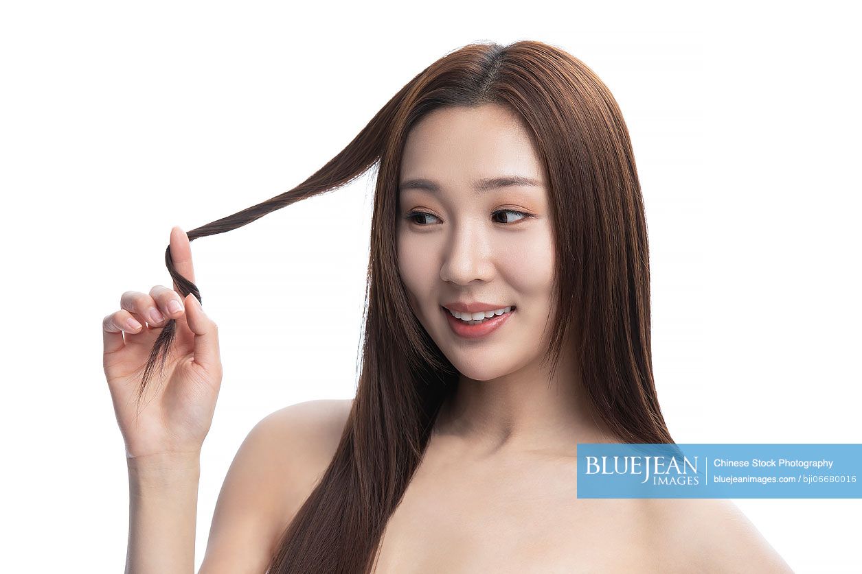 Beautiful young Chinese woman with long hair-High-res stock photo for download