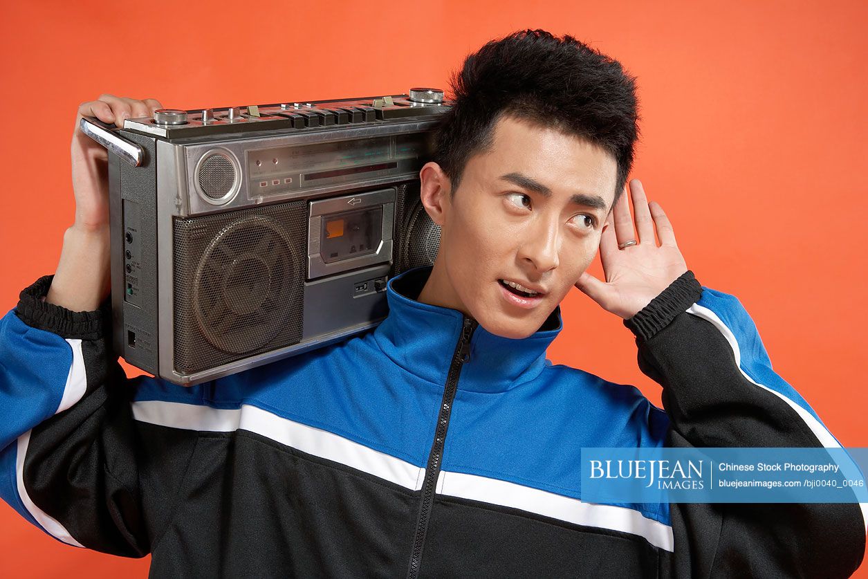 Man Holding Boombox