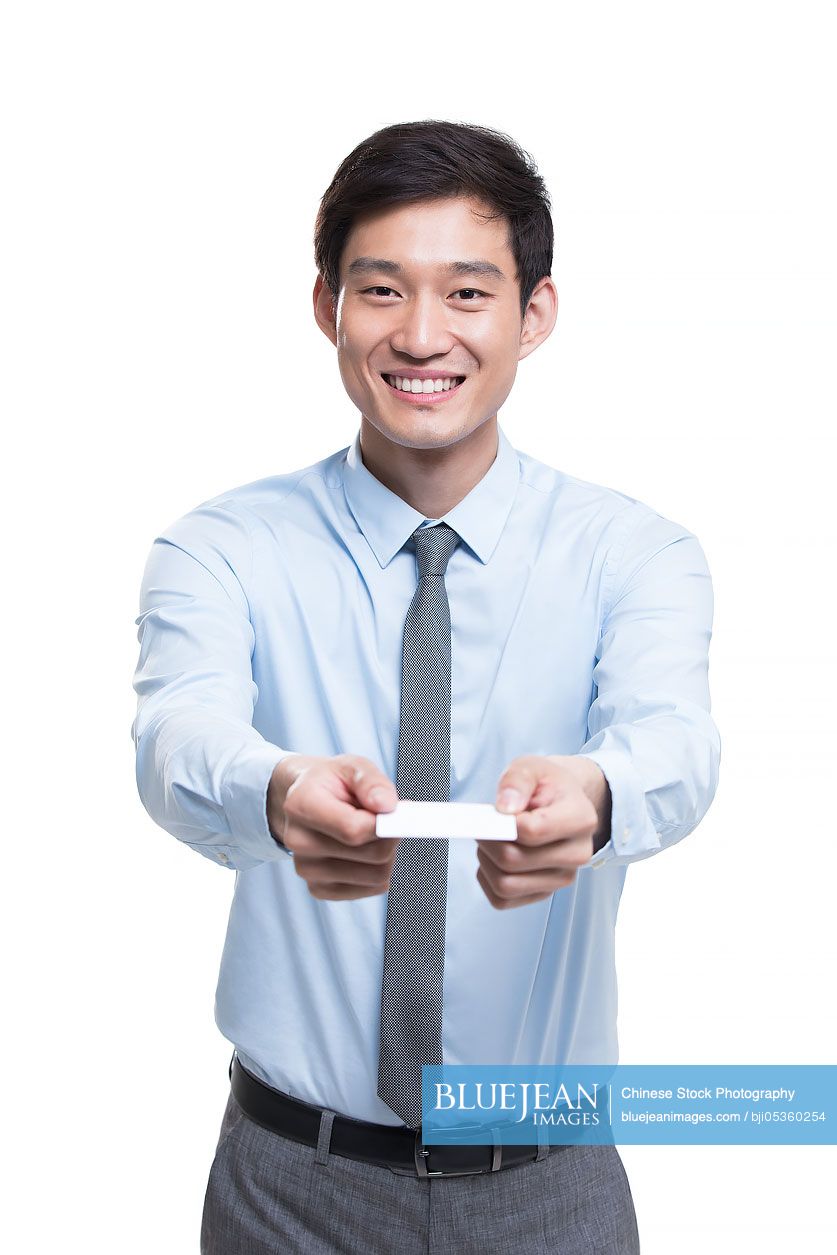 Young Chinese businessman offering business card-High-res stock photo ...