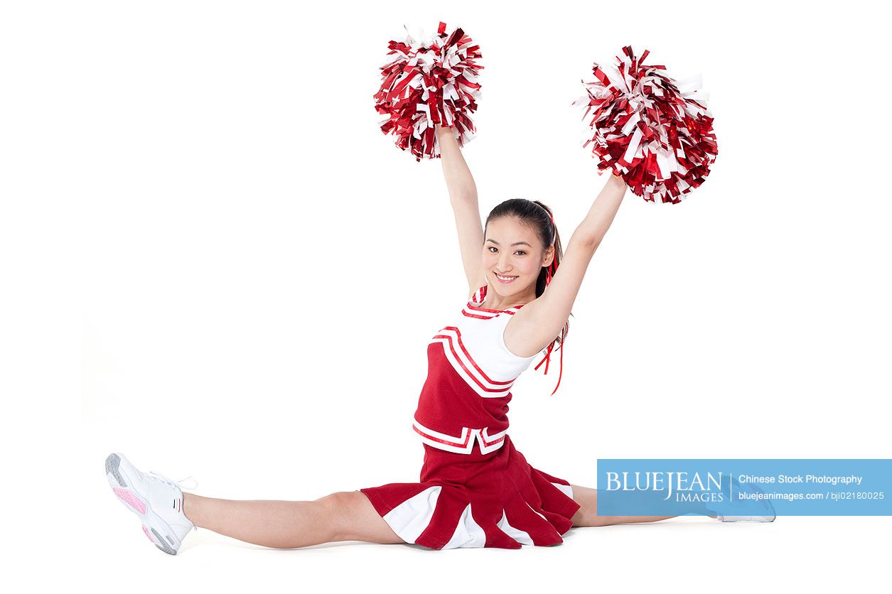 Chinese cheerleader in action with her pom-poms-High-res stock photo ...
