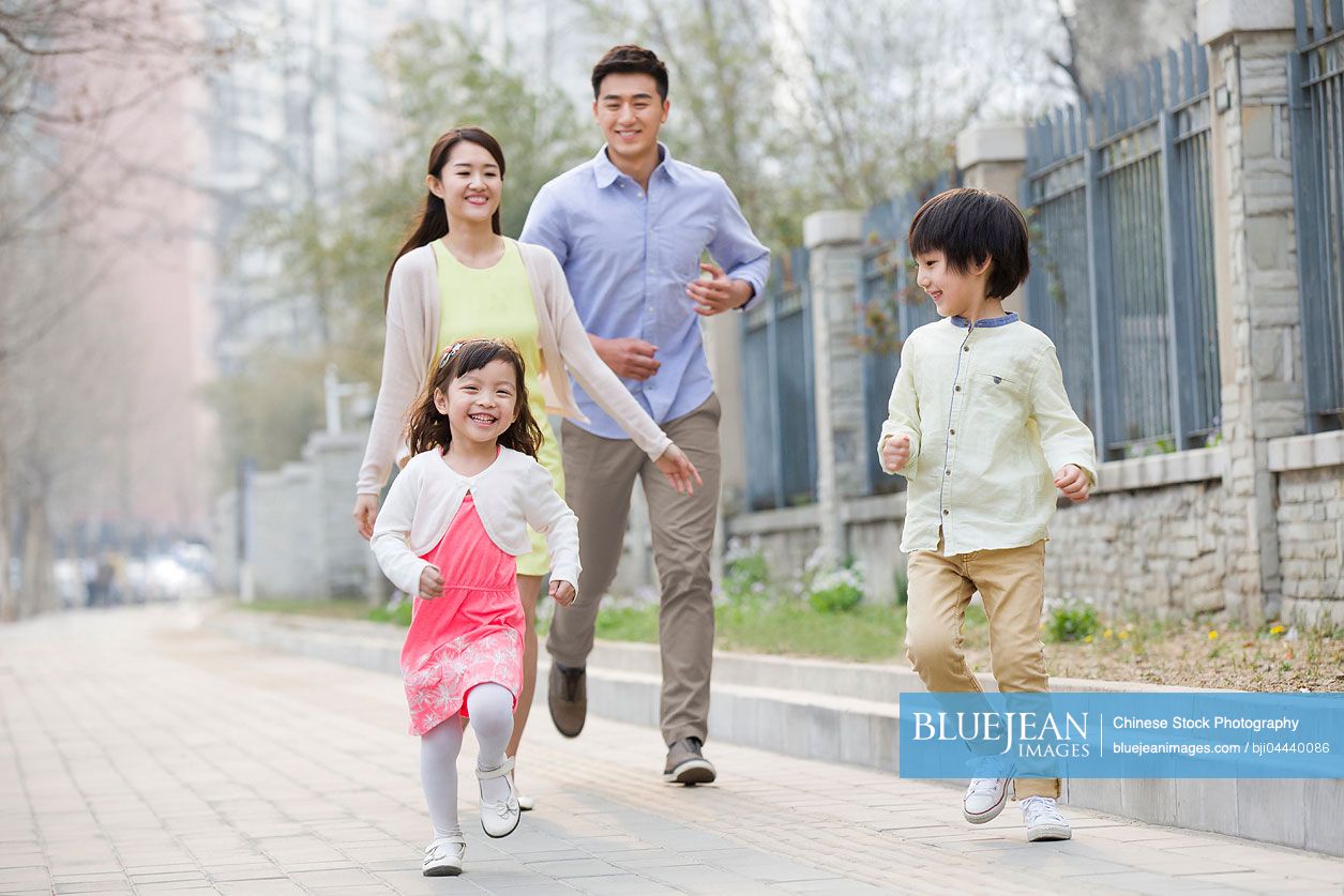 Happy young Chinese family running-High-res stock photo for download