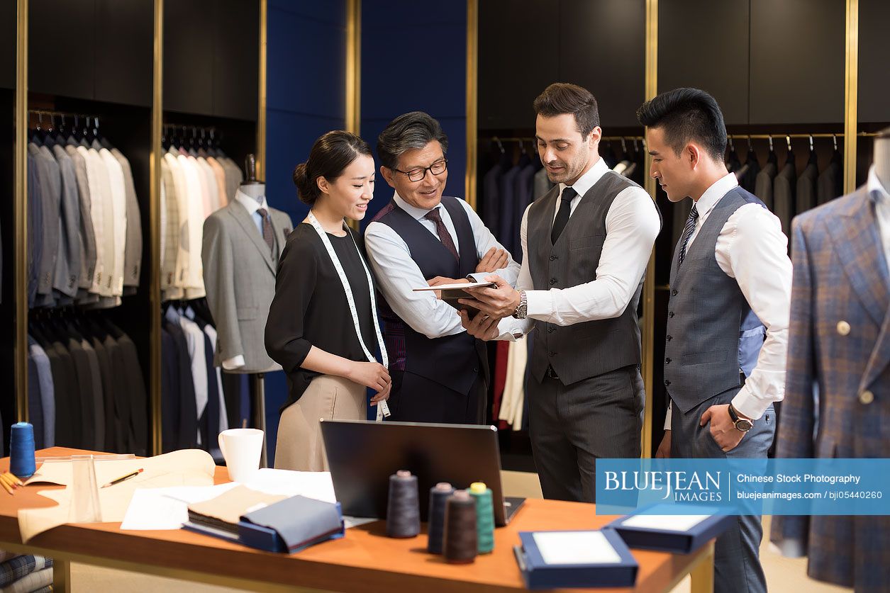 Confident Chinese fashion designers working-High-res stock photo for download