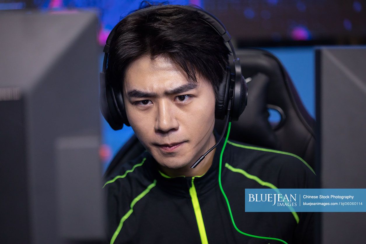 Young Chinese man playing esports-High-res stock photo for download