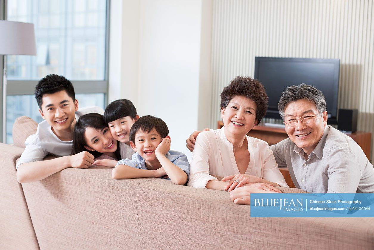 Happy big Chinese family sitting in a row-High-res stock photo for download