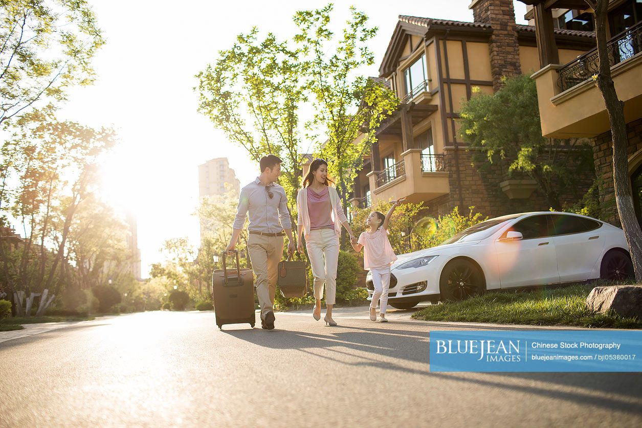 Happy young Chinese family going for vacation-High-res stock photo for ...