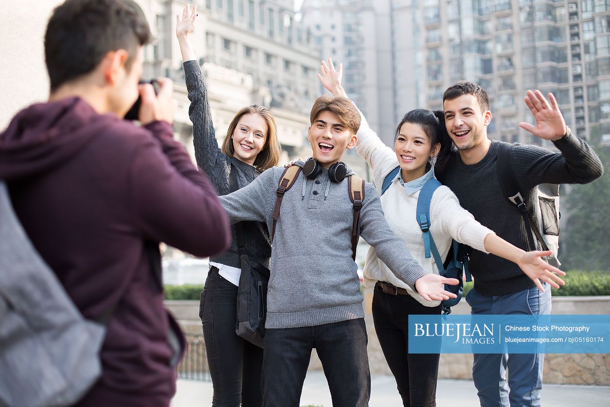 Cheerful abroad students taking photos on campus-High-res stock photo ...